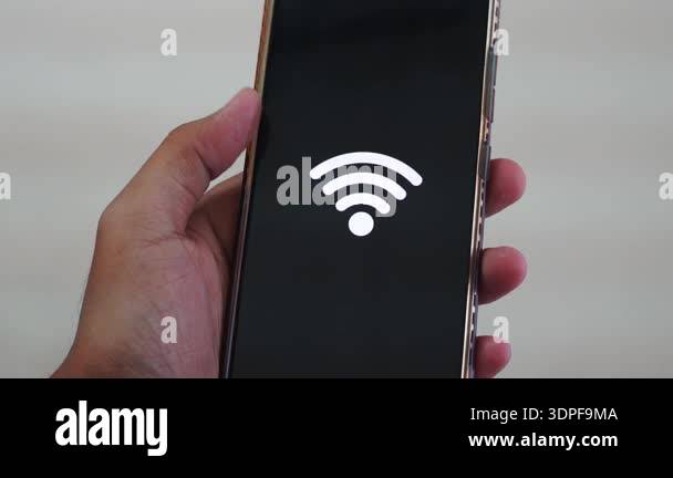 Person using smartphone to connect to wireless internet with wifi ...