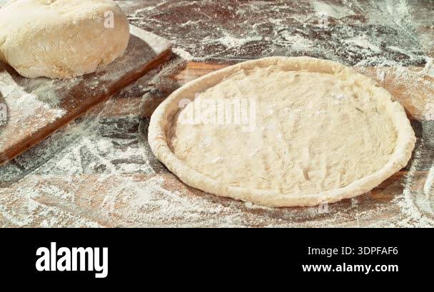Super slow motion, 1000 fps of falling flour dusting freshly kneaded ...