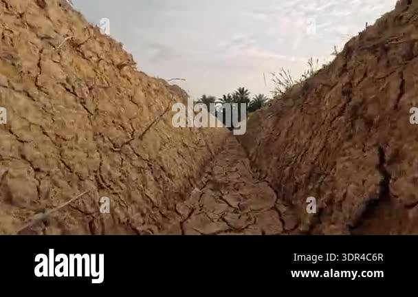 Landscape footage of the dry season ditch drainage system scene at the ...