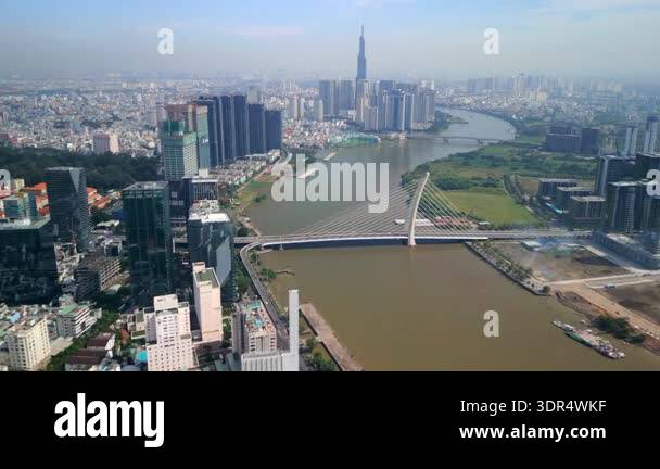 Aerial view of Ho Chi Minh City skyline with bridge over Saigon River ...