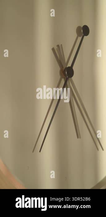 Clock hands move on the wall and create interesting shadows Stock Video ...