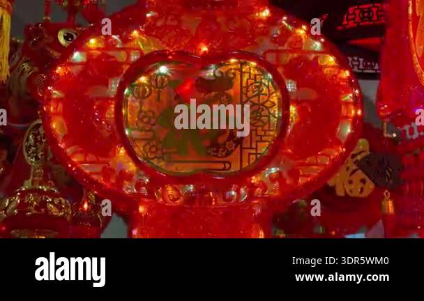 Rotating illuminated Chinese red lantern with red fringe and other ...