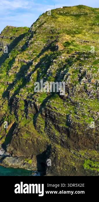Close up of a steep mountain slope showing rock formations and sparse ...