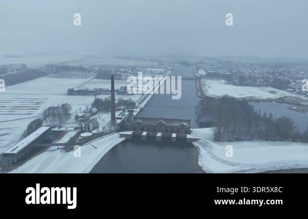 View of a historic European pumping station with traditional industrial ...