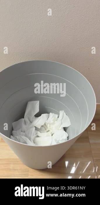 Proper Disposal of Used Tissue Paper into Grey Trash Bin for Hygiene ...