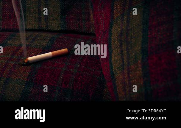 Smoking Cigarette On Chair Fire Hazard Stock Video Footage - Alamy