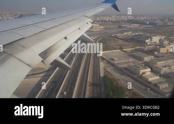 Abu Dhabi, UAE - January 18, 2026: Airplane wing with flaps extended ...