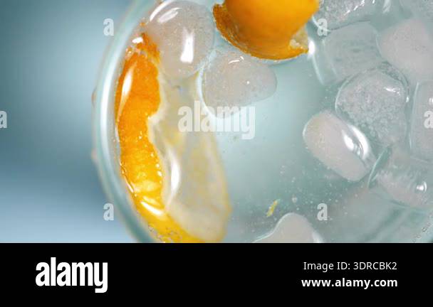 Lemonade with lemon slices and ice in a glass close up macro zoom flat ...