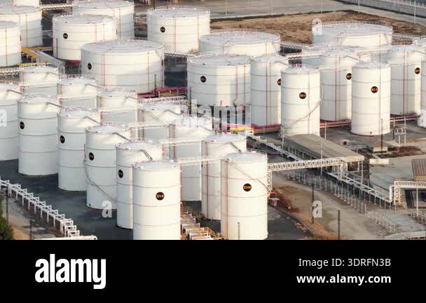Large white storage tanks at a refinery or chemical plant storing oil ...