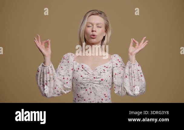 Calm woman relaxing, meditating, refuses stress. Lady breathes deeply ...