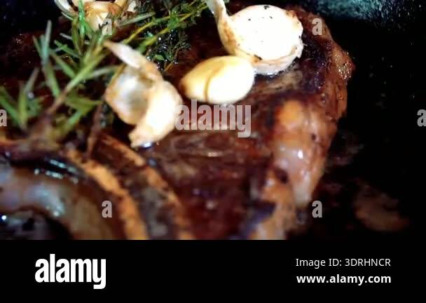 Juicy ribeye steak cooked to perfection, showcasing rich marbling and ...