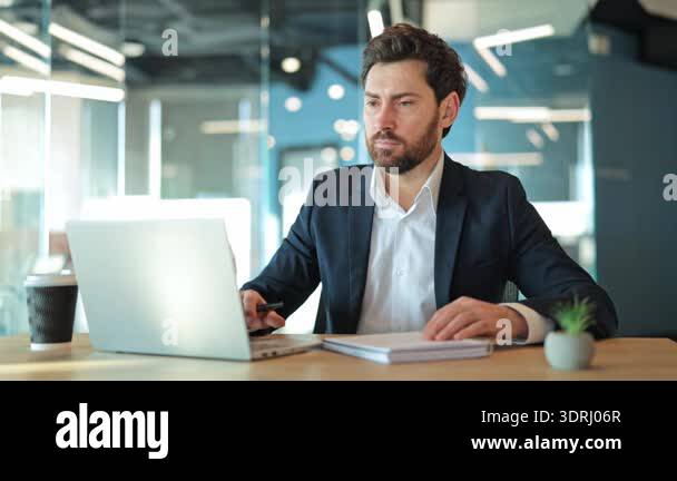 Professional working in contemporary office setting, demonstrating ...