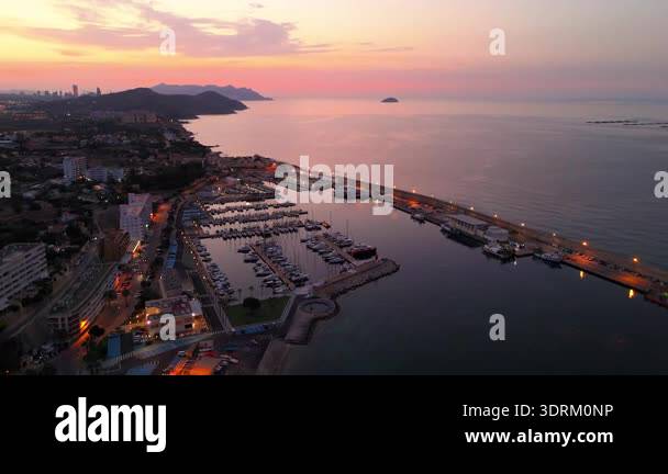 Aerial perspective captures tranquil marina at sunset, highlighting ...