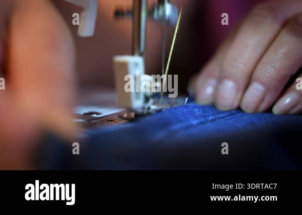 Working sewing machine presser foot, Close up of sewing machine ...
