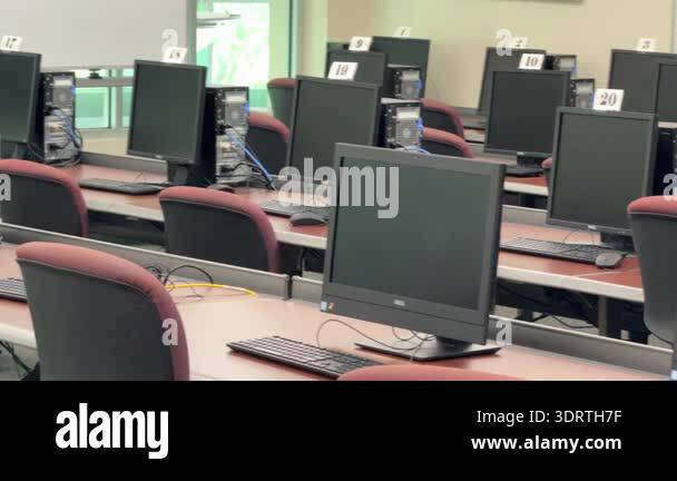 Orlando, Florida, USA - 03.13.2024: Rows of desktop computers sit ready ...