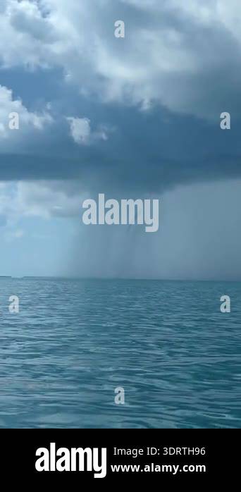 This vertical static video shows a waterspout forming over the Gulf of ...