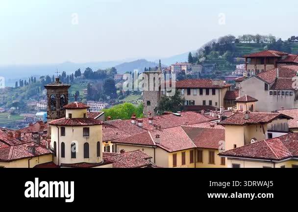 Panorama of the medieval city towers and tile roofs of houses, mansions ...