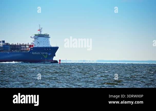 New York, USA, 5 October 2025: Bow of a blue container ship on open sea ...