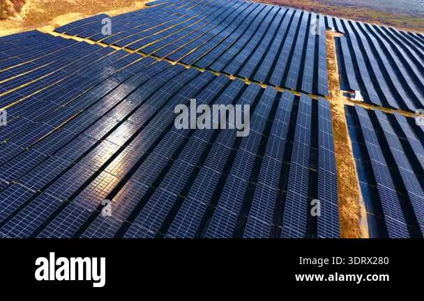 Solar panels rows with reflection. High angle perspective of ...