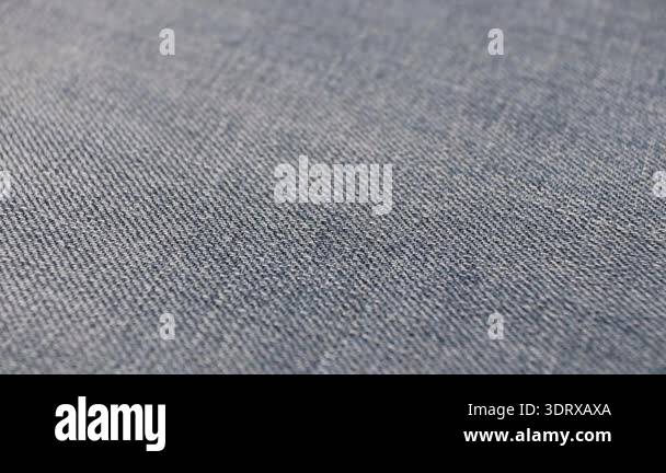 Static isometric view of worn blue denim fabric with shallow depth of ...