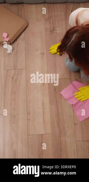 Top view Caucasian woman wiping washing floor with eco cleaning ...