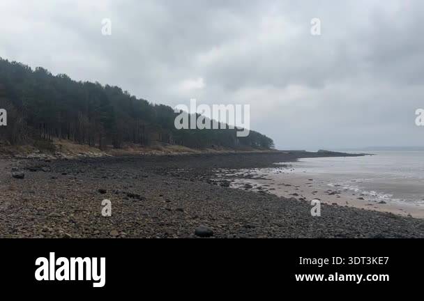 Rugged rocky coastline surrounding Braefoot Bay on Fife coast Scotland ...