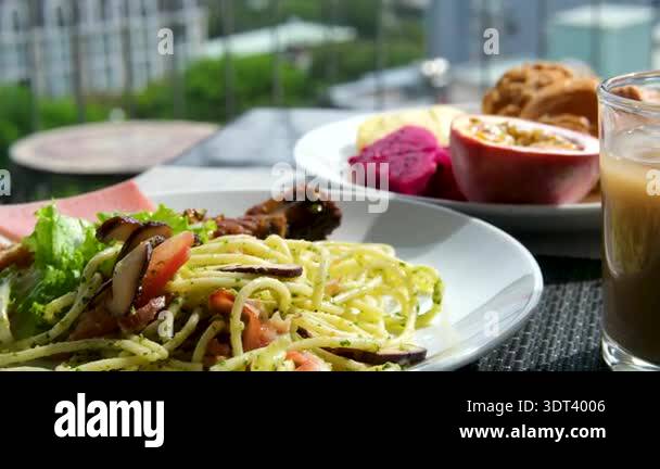 Breakfast in Asia: omelette, fried egg, noodles, pasta, greens ...