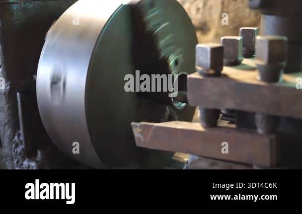 Close up of milling machine in action. Side view on rotating old ...