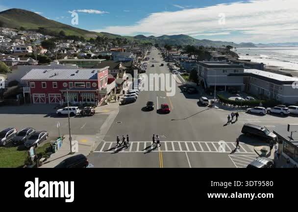 Wide aerial shot of Cayucos Pier and downtown district in Cayucos ...