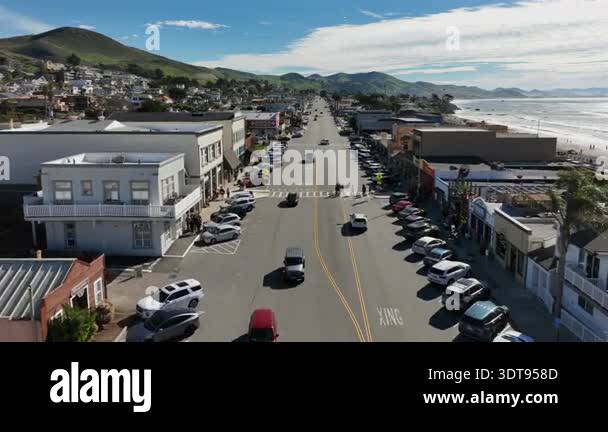 Overhead footage of Cayucos Pier in downtown Cayucos showing visitors ...