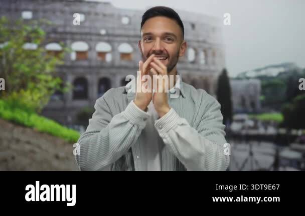Young hispanic man excitedly shouting outside the iconic coliseum in ...