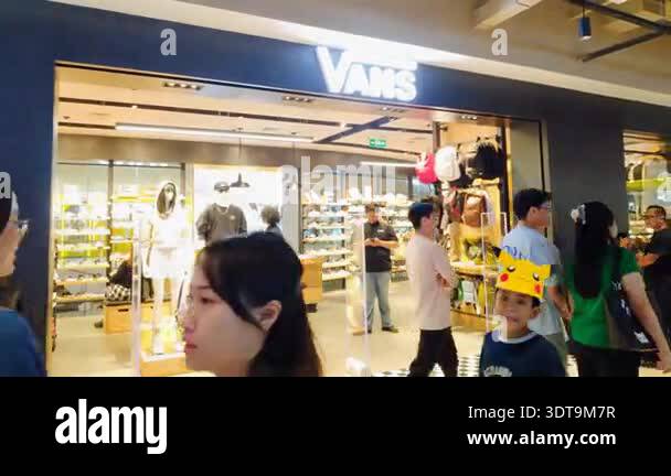 Young shoppers explore trendy sneakers and urban apparel at a vibrant ...