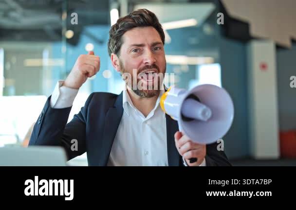 Confident business professional holds megaphone, gives thumbs-up, and ...