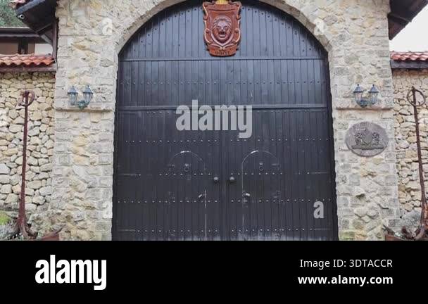 Authentic medieval-style Balkan stone gate with heraldic crest, lion ...
