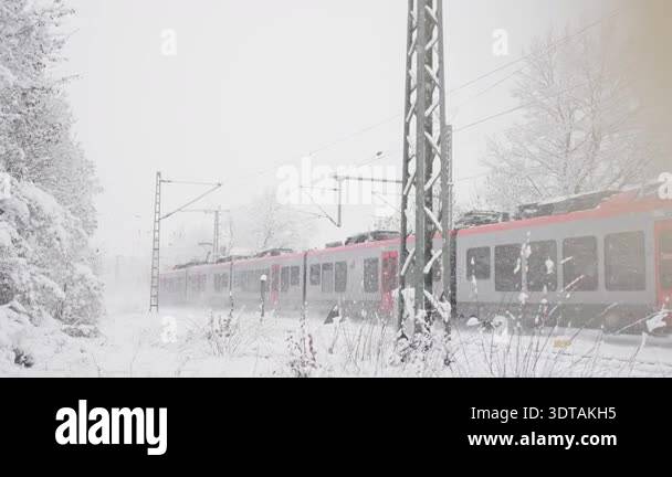 Snowy Railway Scene With Moving Train, Red Commuter Carriage Streaking ...