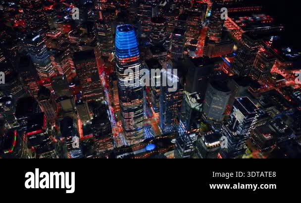 Footage over the blue neon top of the Salesforce Tower in midtown San ...