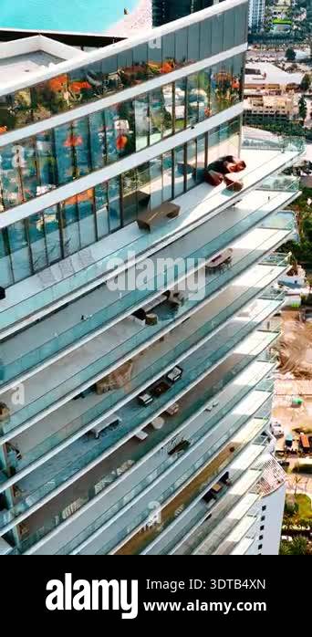 Rising close to the modern high rise building with big balconies ...