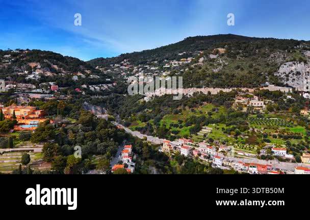Verdant mountains covered with beautiful villas and hotels. Scenic view ...