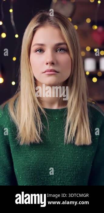 Woman looks sad with garlands in background during a candid portrait ...