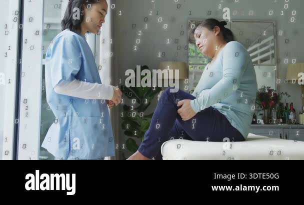 Patient lifting leg expressing knee pain, nurse palpating knee range ...