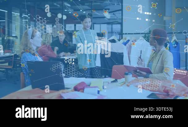 Designer selecting outfit presenting features for review while team ...