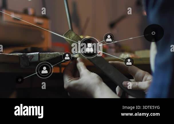 Jewelry craftswoman filing metal bit and causing network icons around ...