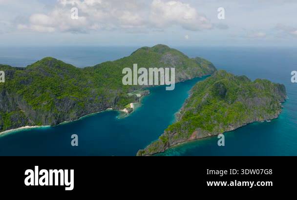 White Beach in Tapiutan Island. Matinloc Island with blue sea. El Nido ...