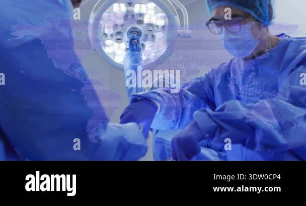 Medical team aligning LED light and passing instruments for ...