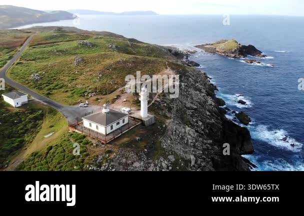 Aerial Lighthouse Atop Rocky Promontory, Keeper Cottage Visible ...