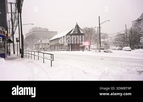 NORWALK, CT, USA - FEBRUARY 23, 2026: Heavy snow falling on a city ...