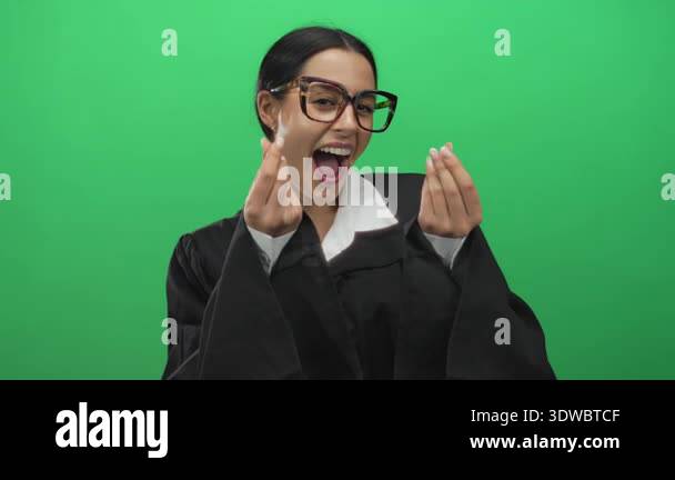 Woman judge smiling in black robe making money gesture on isolated ...