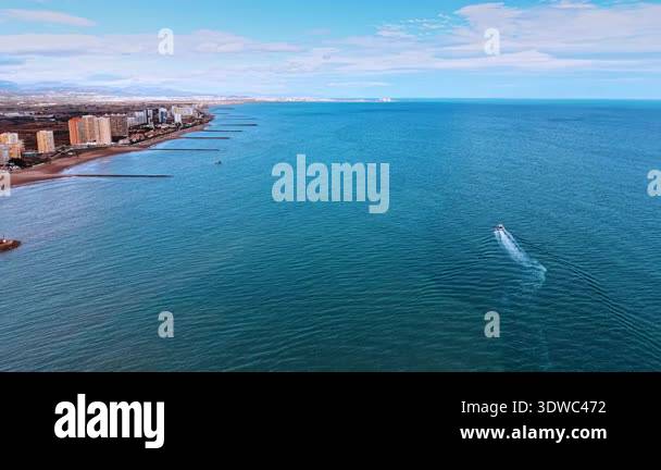 Distant aerial view of coastline and city horizon line. Wide high ...