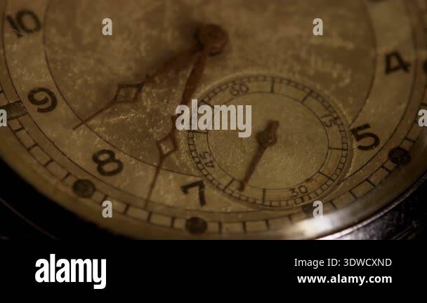 macro shot of a worn antique watch face with a small second hand dial ...