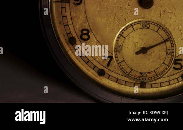 Side angle close up of a vintage mechanical pocket watch with moving ...